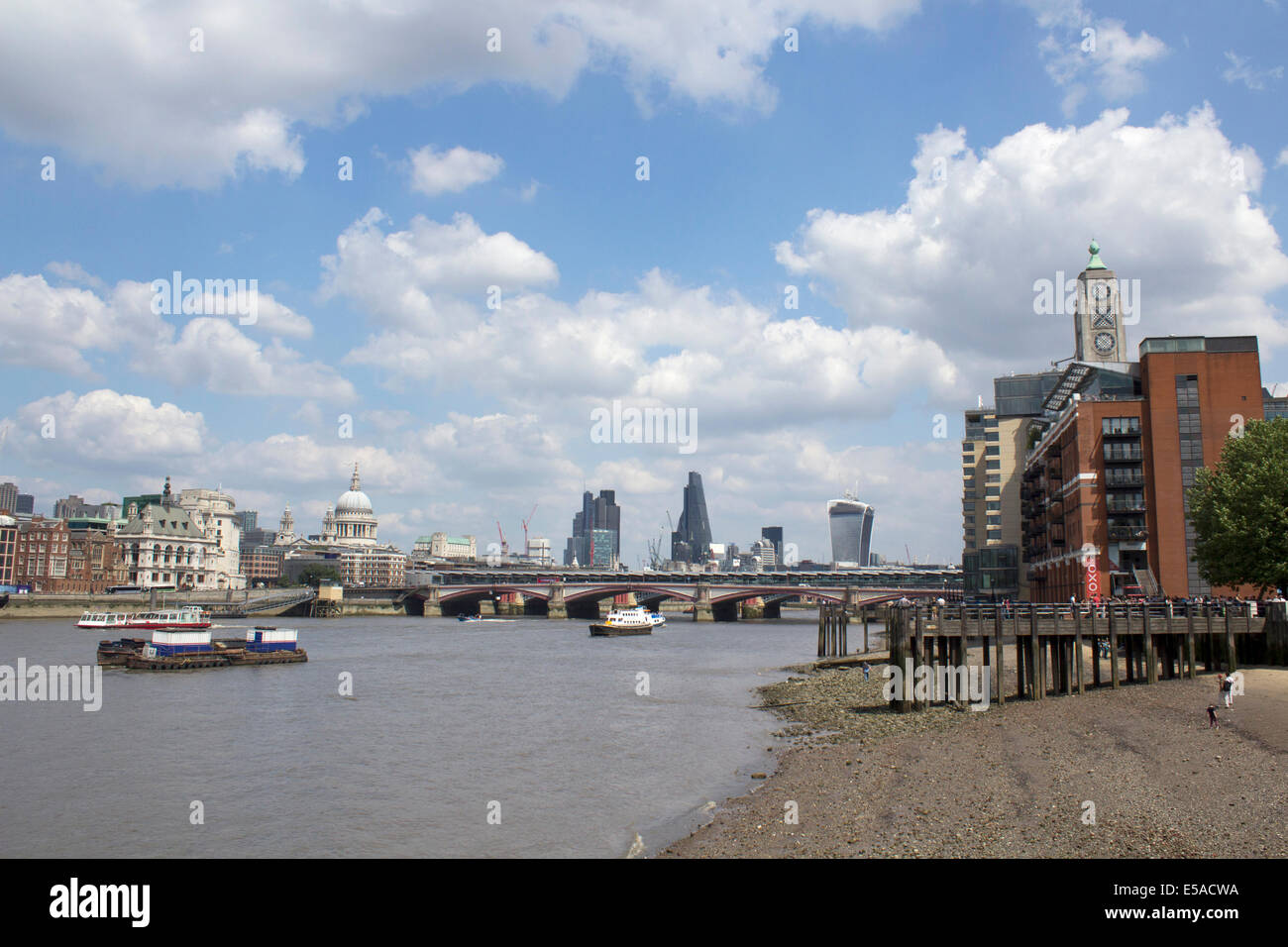 LONDON - JUNE 21. Low tide at the Oxo Tower Wharf building with St ...