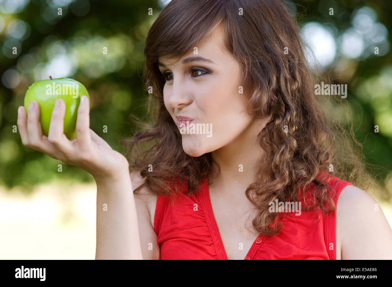 Woman face thinking apple hi-res stock photography and images - Alamy