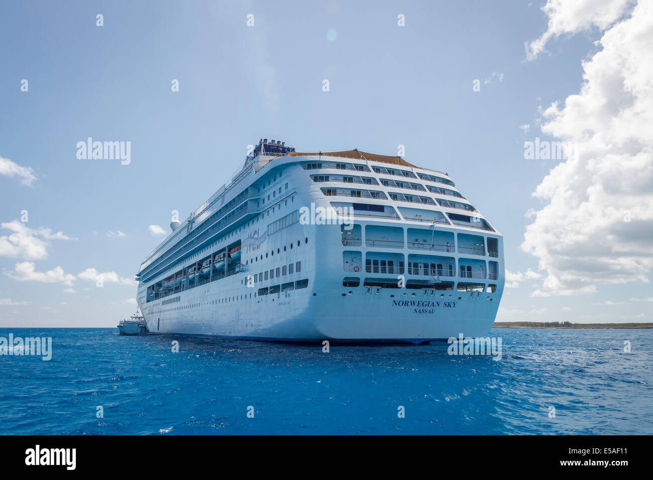 The NCL cruise ship "Norwegian Sky" anchored in the calm tropical ...