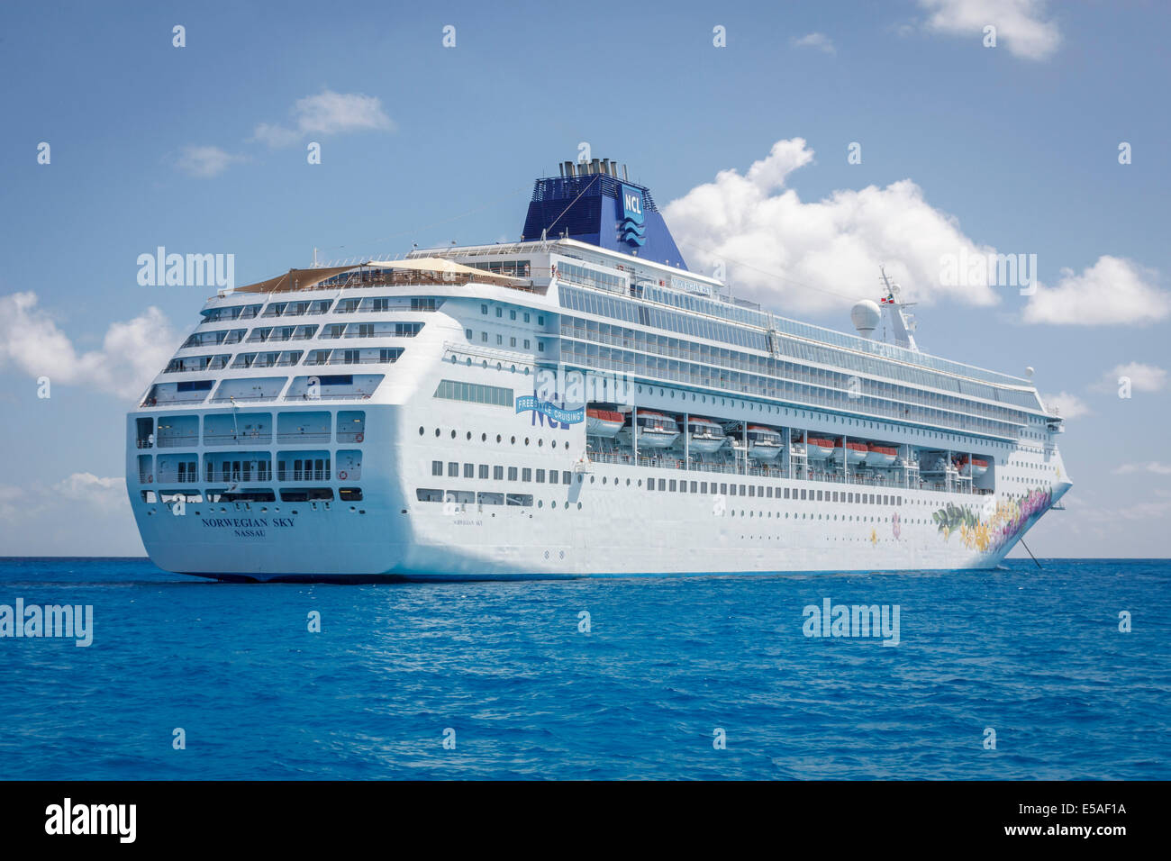 The NCL cruise ship "Norwegian Sky" anchored in the calm tropical ...