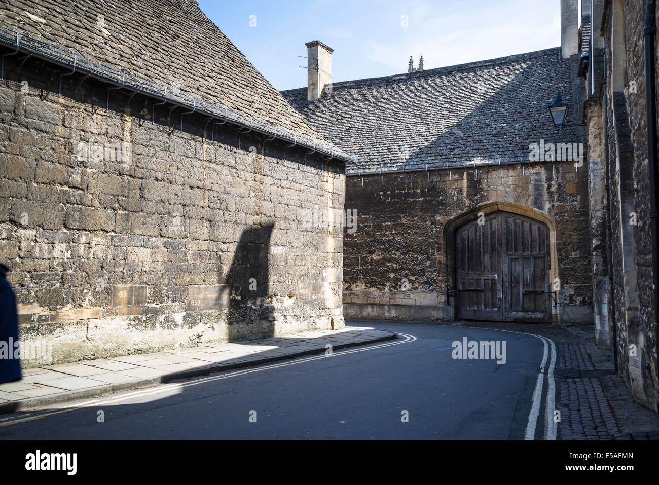 Street corner with old wooden gate, New College Lane, Oxford, England ...