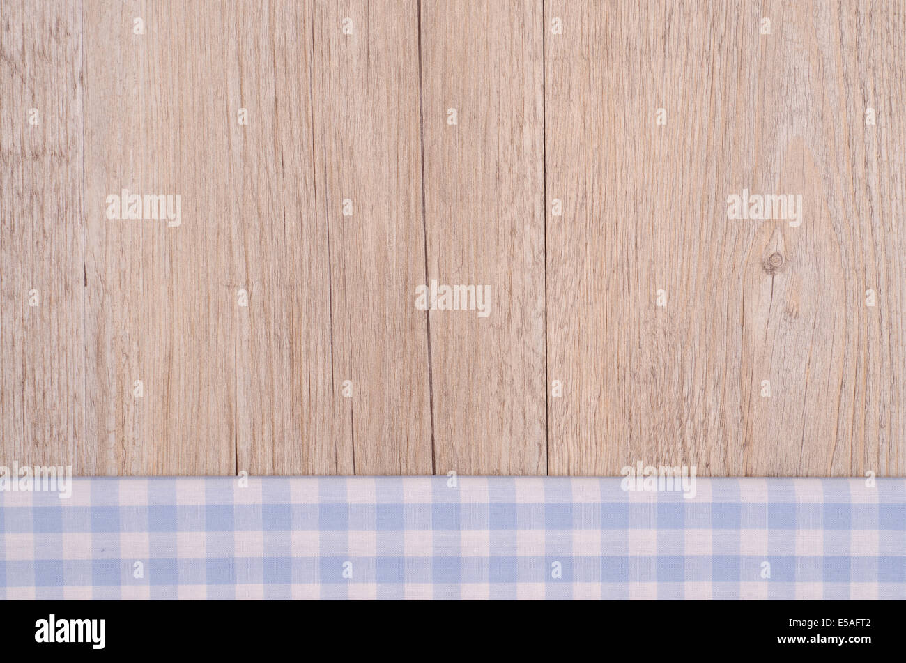 Cloth with light blue checks on old wooden background Stock Photo - Alamy