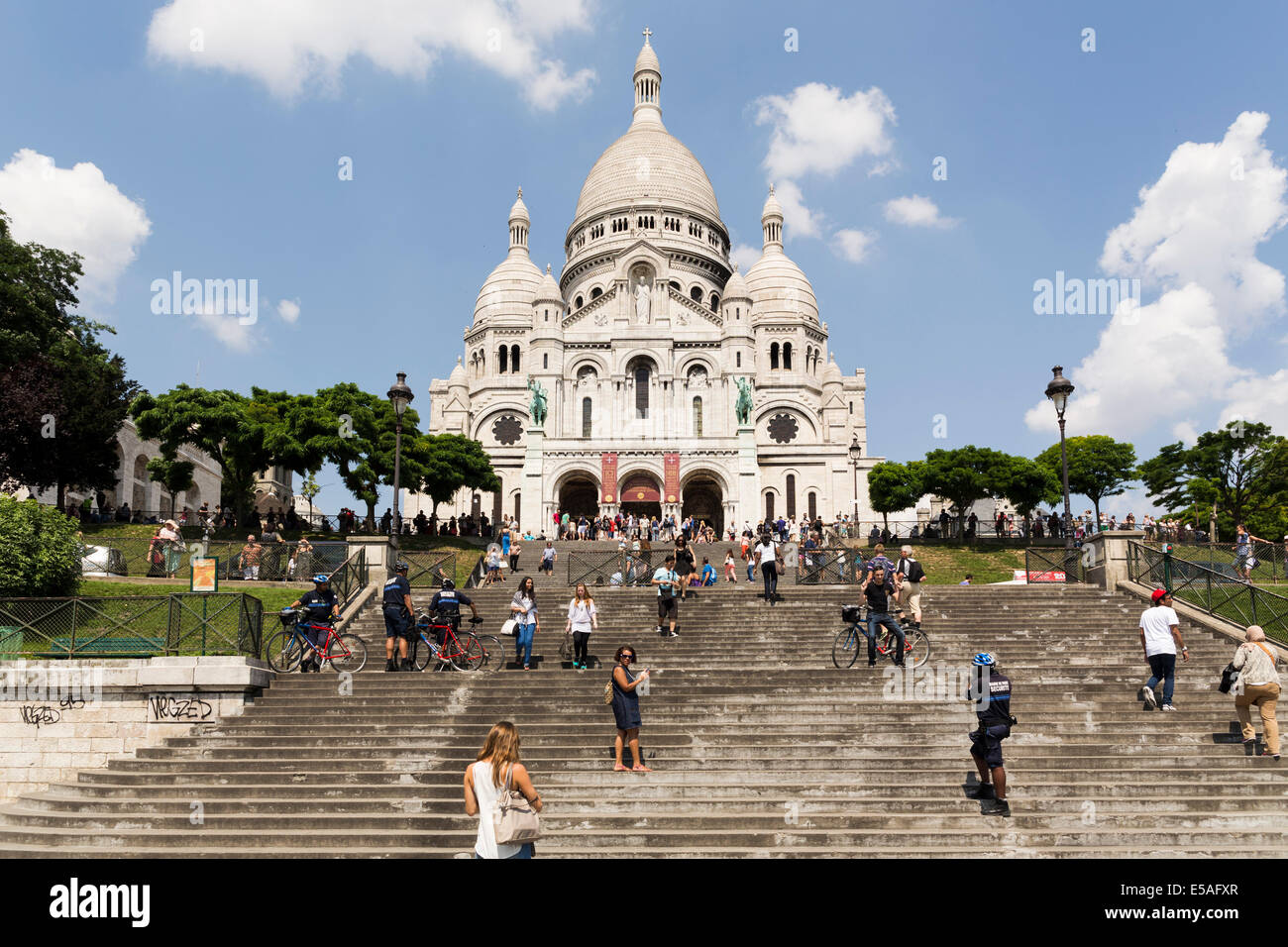Paris, France. 24th July, 2014. Tourist enjoy the warm weather and sit ...