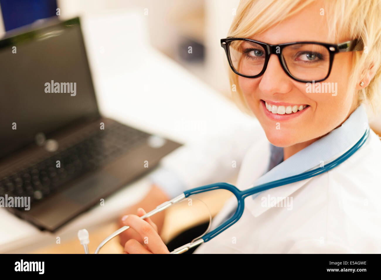 Portrait of beautiful blonde female doctor wearing glasses, Debica ...