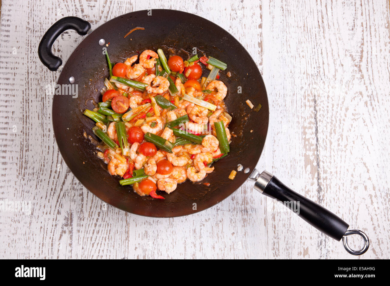 prawn in wok on white table Stock Photo - Alamy