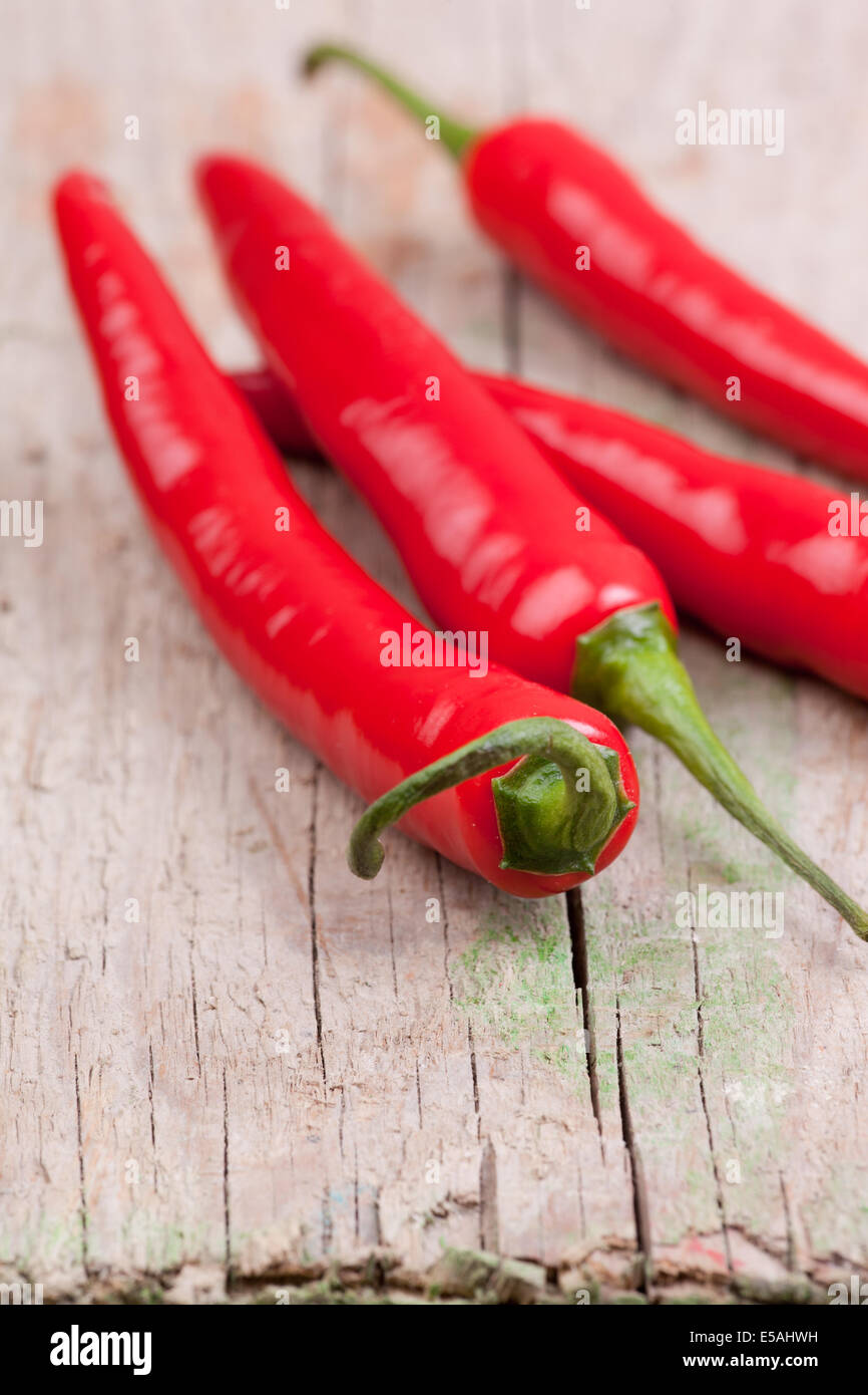 chilli on the rough wood Stock Photo - Alamy