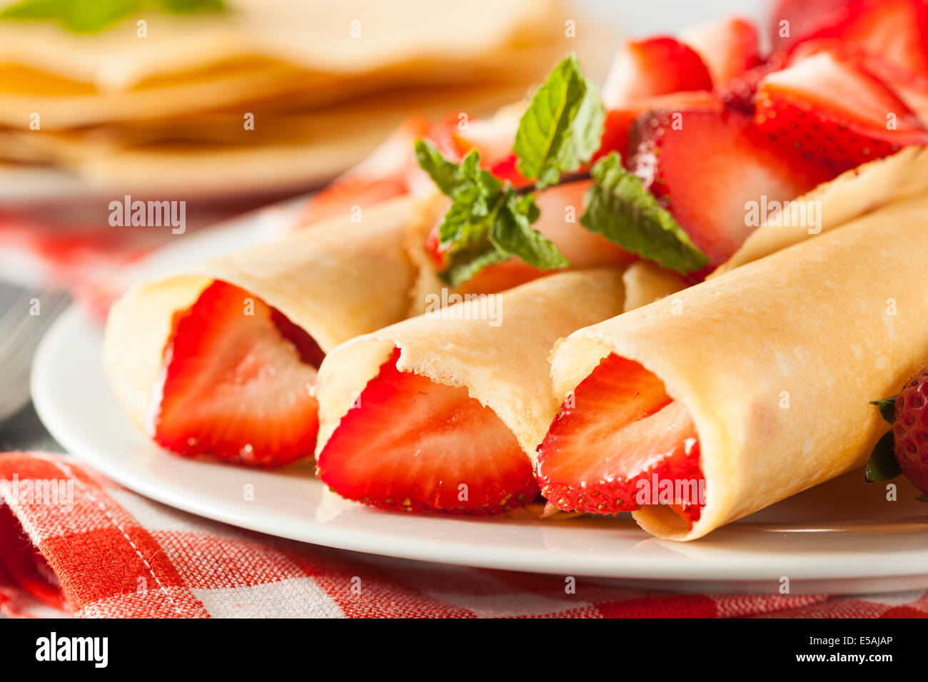 Fresh Strawberry French Crepes with Mint for Breakfast Stock Photo - Alamy