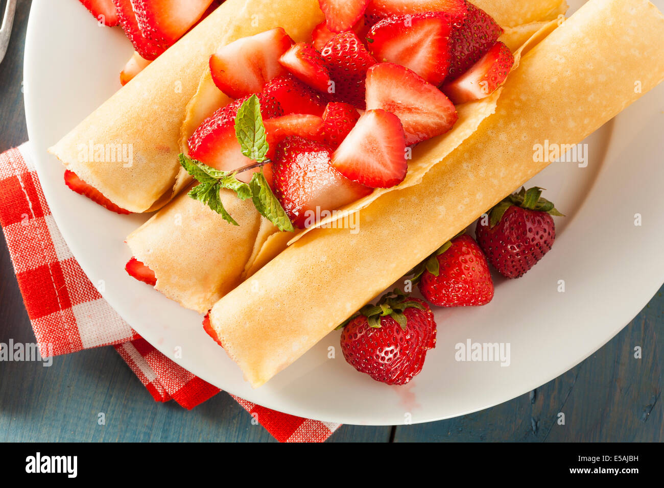Fresh Strawberry French Crepes with Mint for Breakfast Stock Photo - Alamy