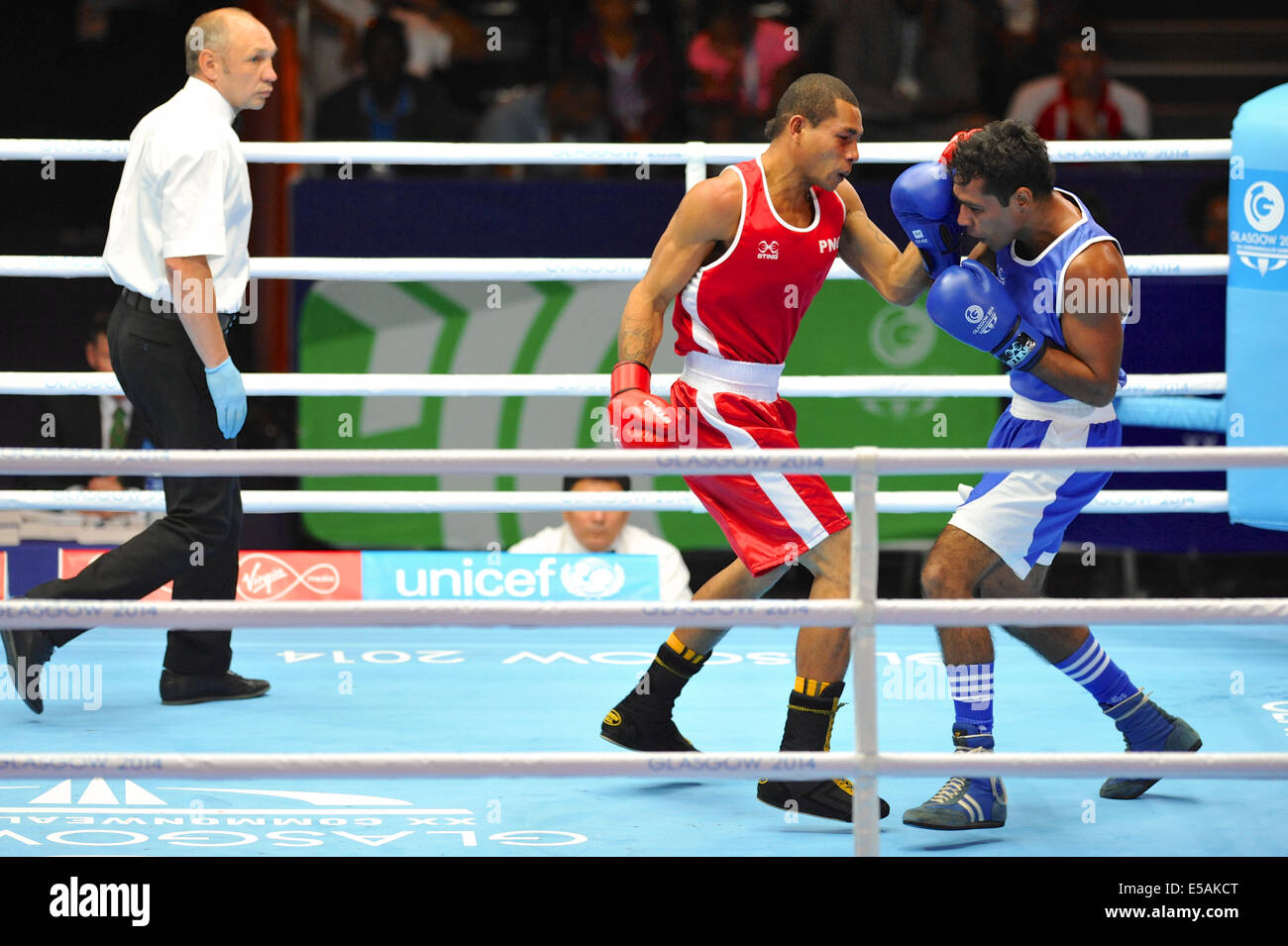 Andrew Aisaga (PNG, red) and Maduranga Pathirage Don (SRI, blue) boxing ...