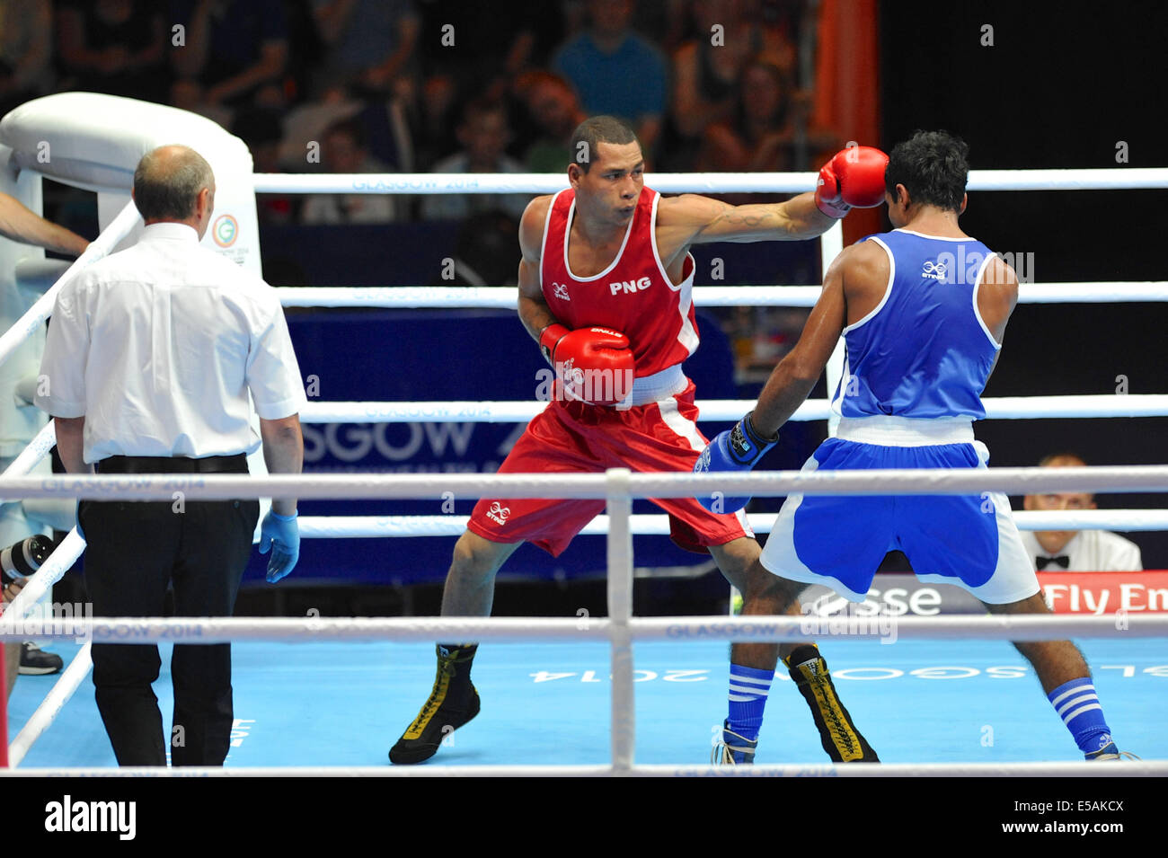 Andrew Aisaga (PNG, red) and Maduranga Pathirage Don (SRI, blue) boxing ...