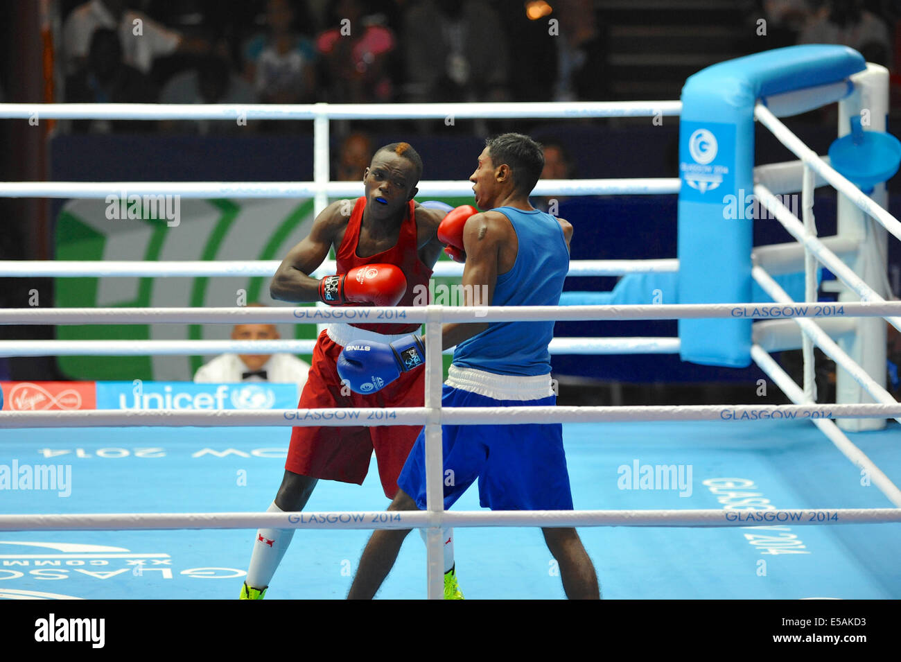 Benson Gicharu Njangiru (KEN, red) and Imran Khan (GUY, blue) boxing ...