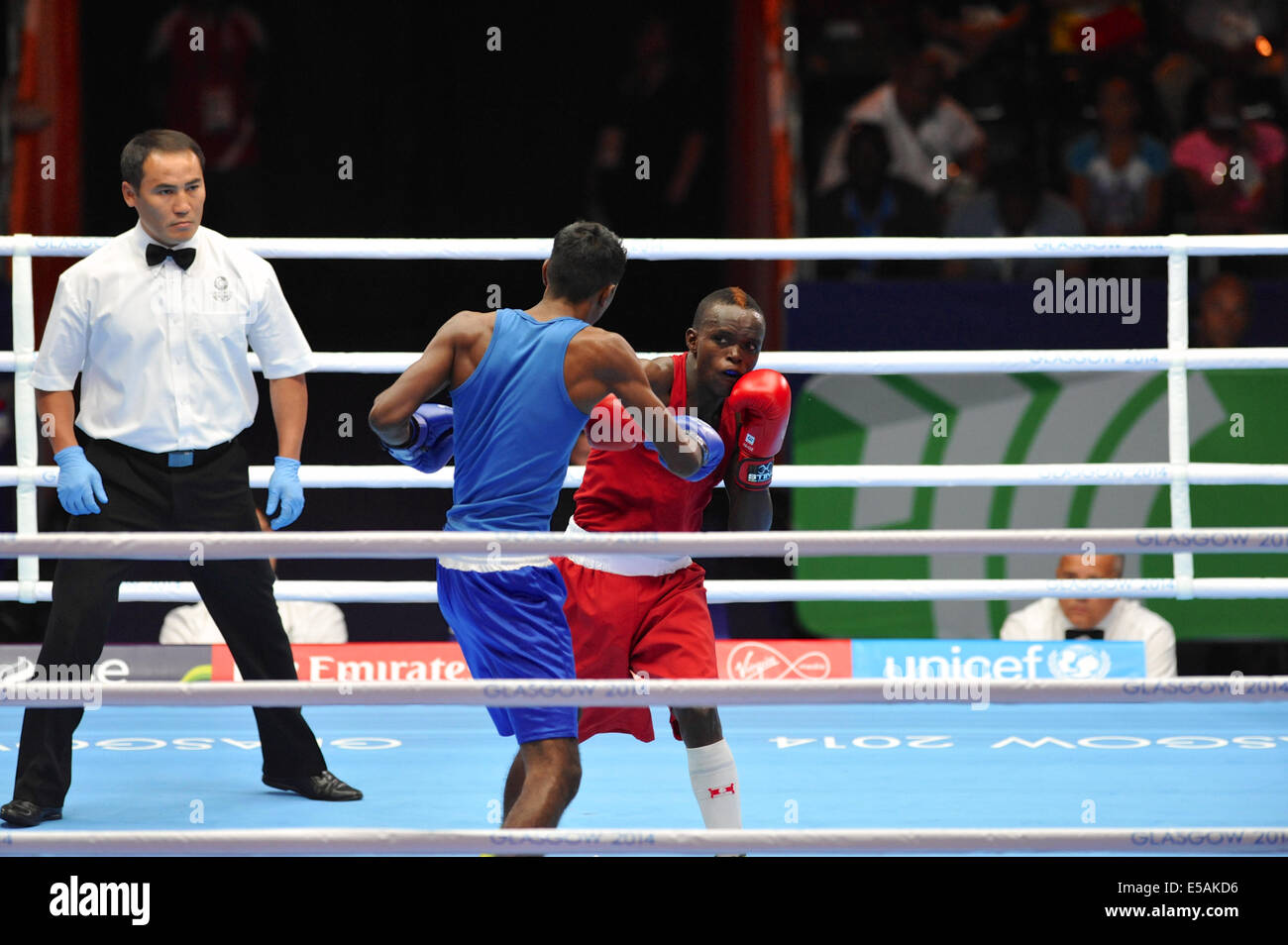 Benson Gicharu Njangiru (KEN, red) and Imran Khan (GUY, blue) boxing ...