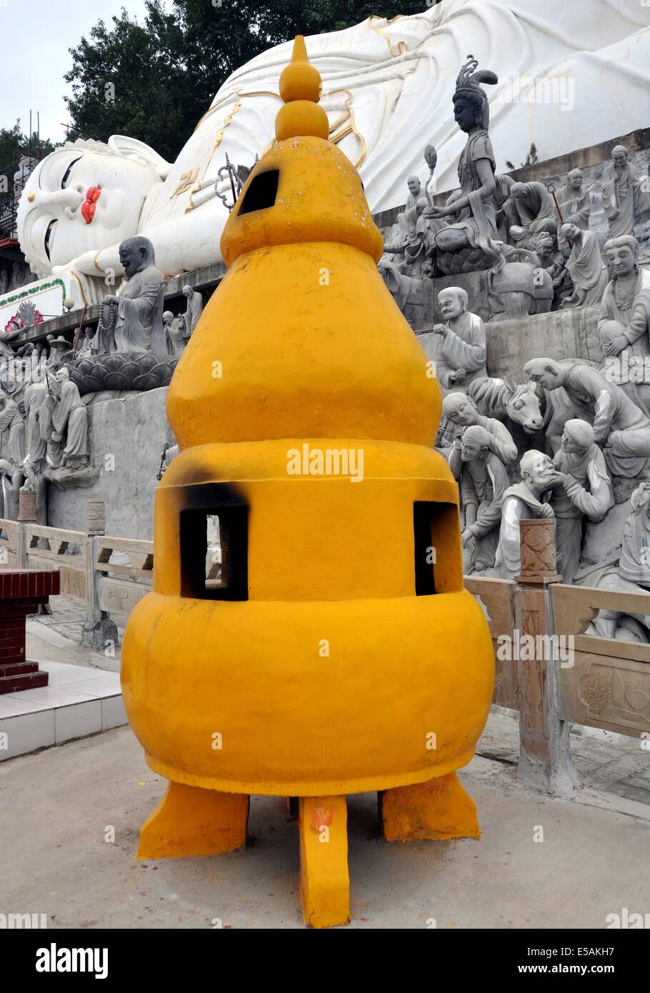 MIANYANG (SICHUAN), CHINA: An ochre-coloured paper brazier stands at ...