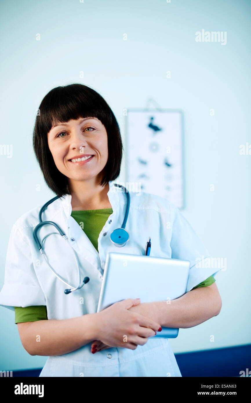Smiling doctor holding tablet debica hi-res stock photography and ...
