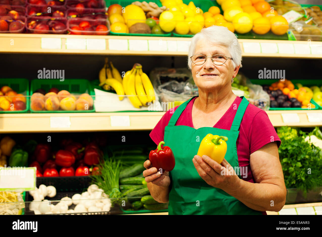 Working in a supermarket senior person hi-res stock photography and ...