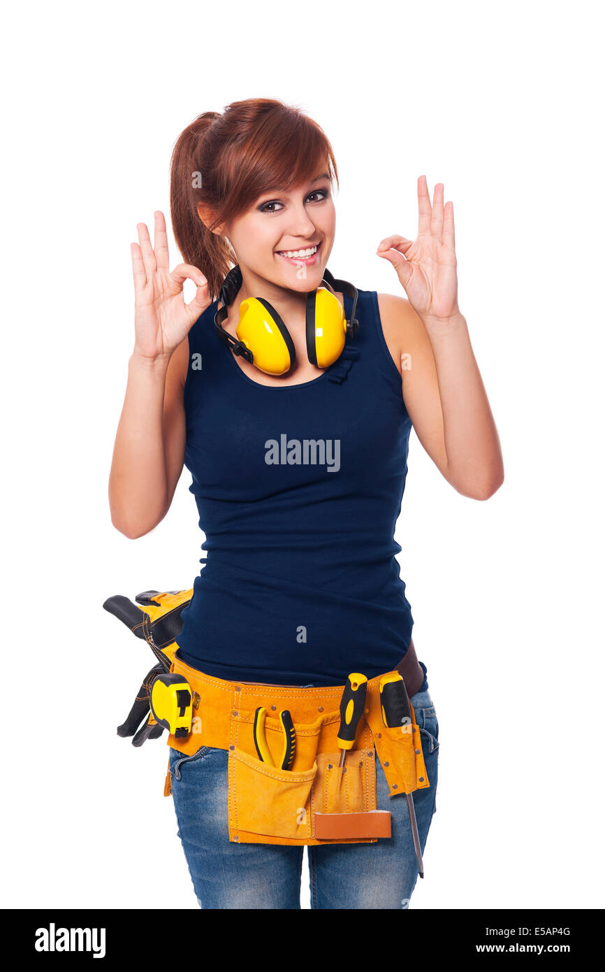 Happy young female construction worker gesturing OK sign Debica, Poland ...