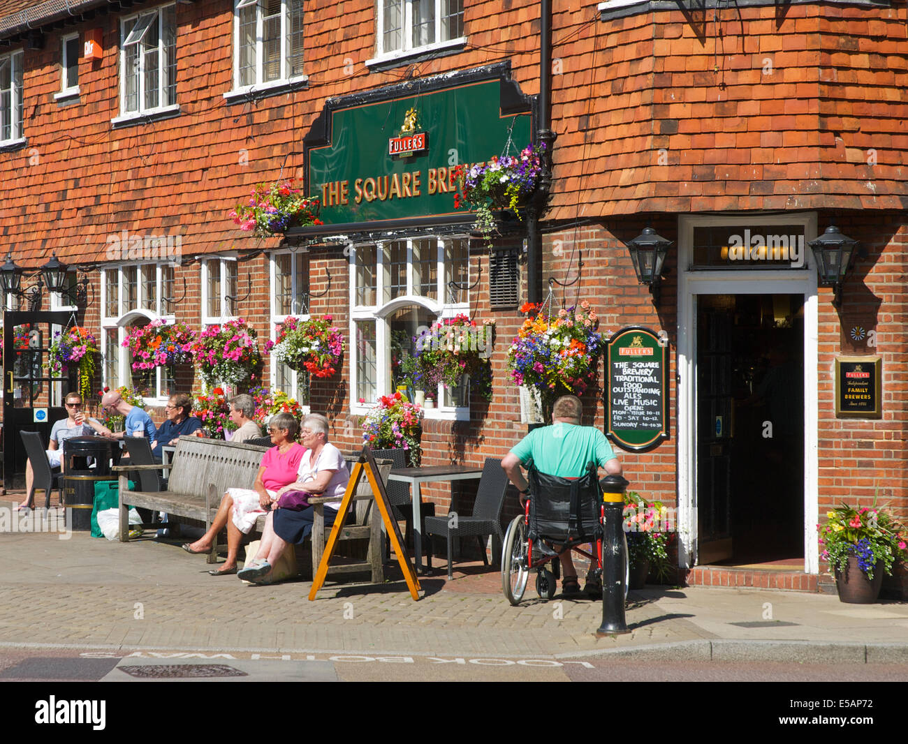 People sitting outside pub, The Square Brewery, in Petersfield ...