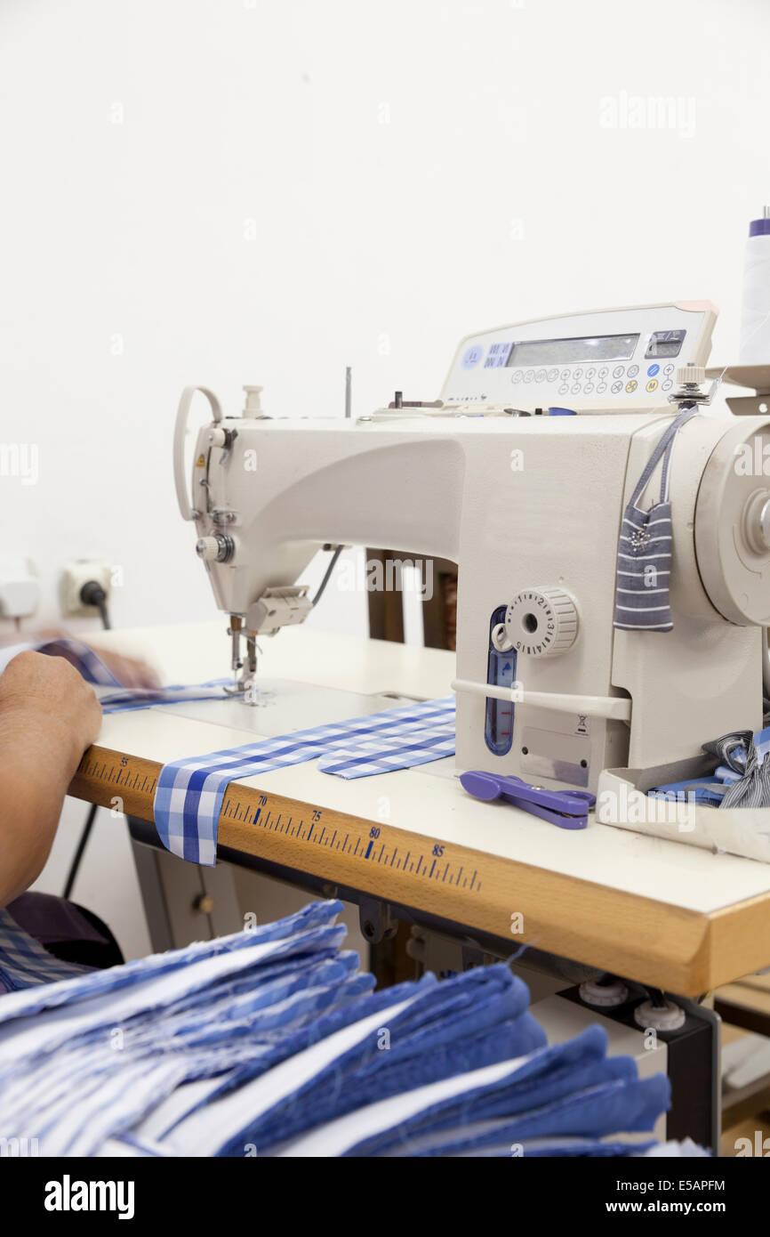 sewing machine working part with blue cloth Stock Photo - Alamy