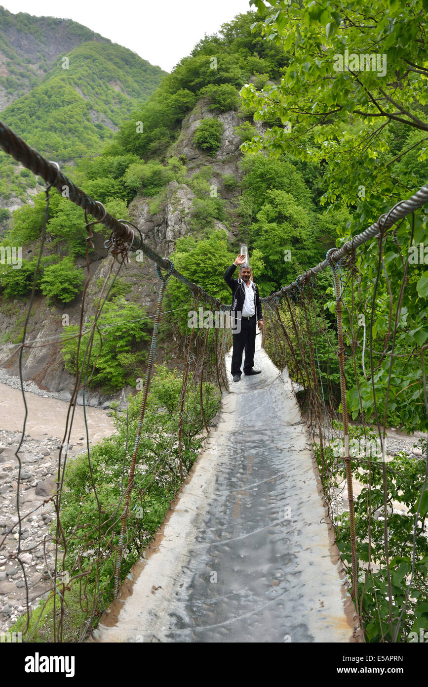 Suspension bridge over a mountain river, Ismayilli Rayon, Caucasus ...