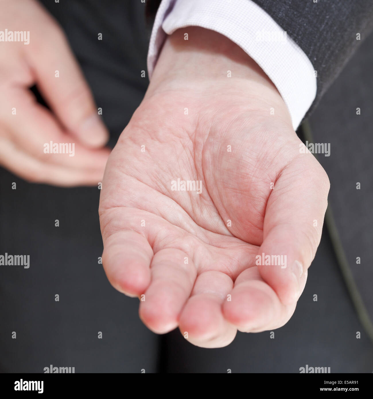 businessman holds empty handful close up - hand gesture Stock Photo - Alamy