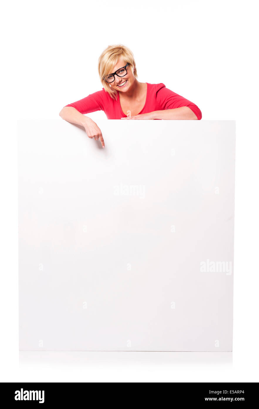 Happy young woman pointing at billboard Debica, Poland Stock Photo - Alamy