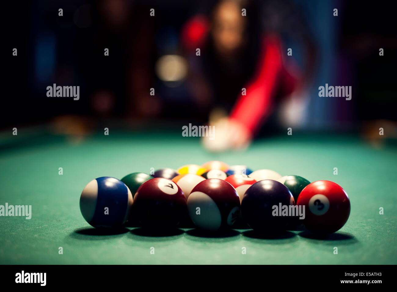 Woman holding billiard ball hi-res stock photography and images - Alamy