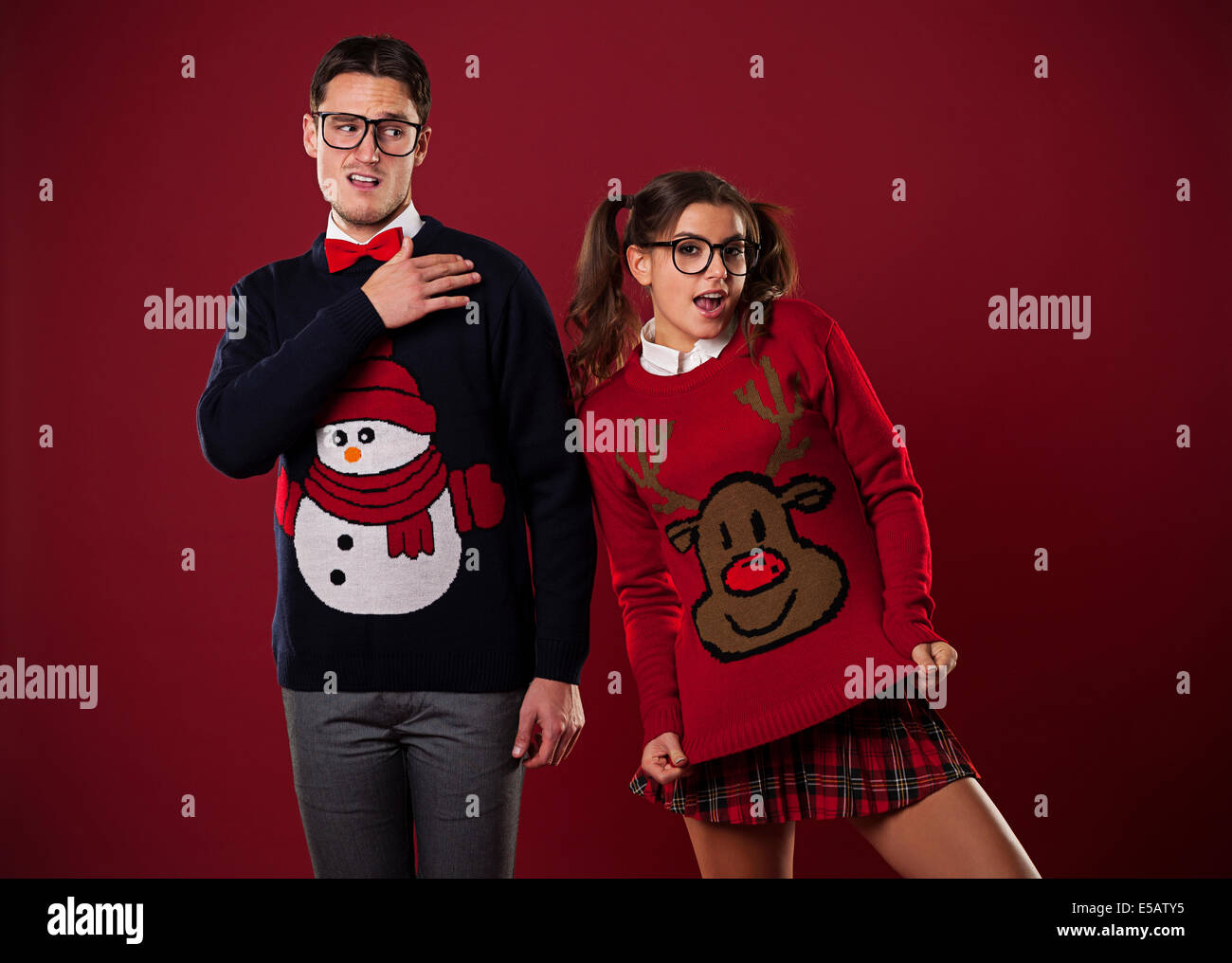 Crazy nerd couple in funny sweaters goofing around Debica, Poland Stock ...
