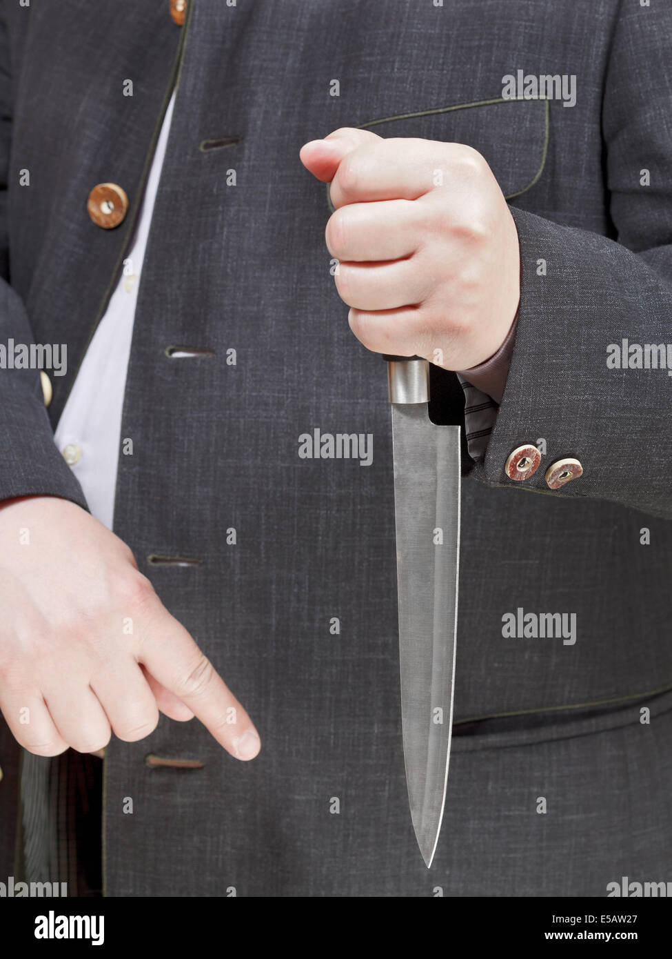 front view of large knife in businessman hand close up Stock Photo - Alamy