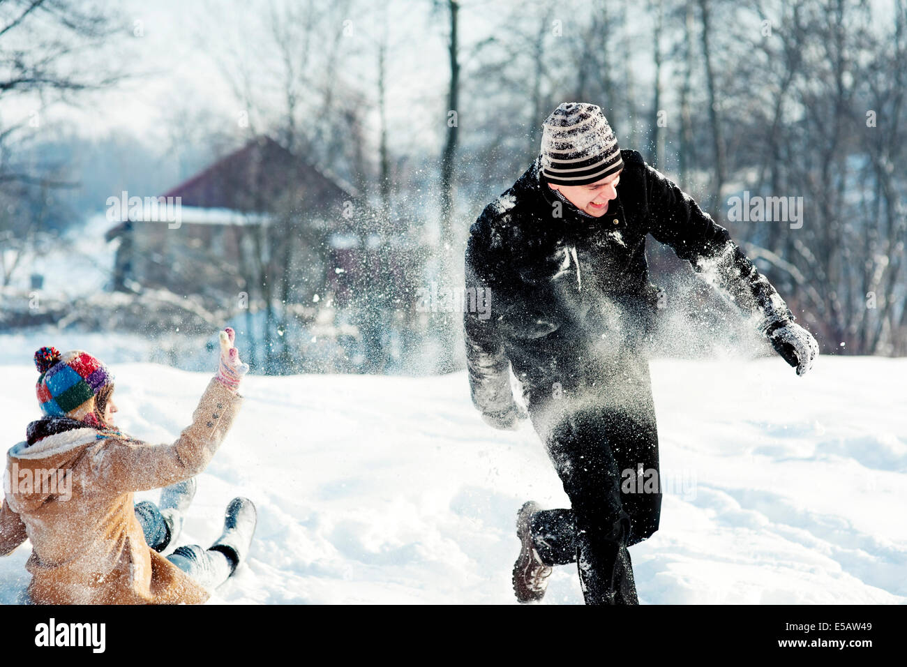 Smiley couple playing outdoors hi-res stock photography and images - Alamy