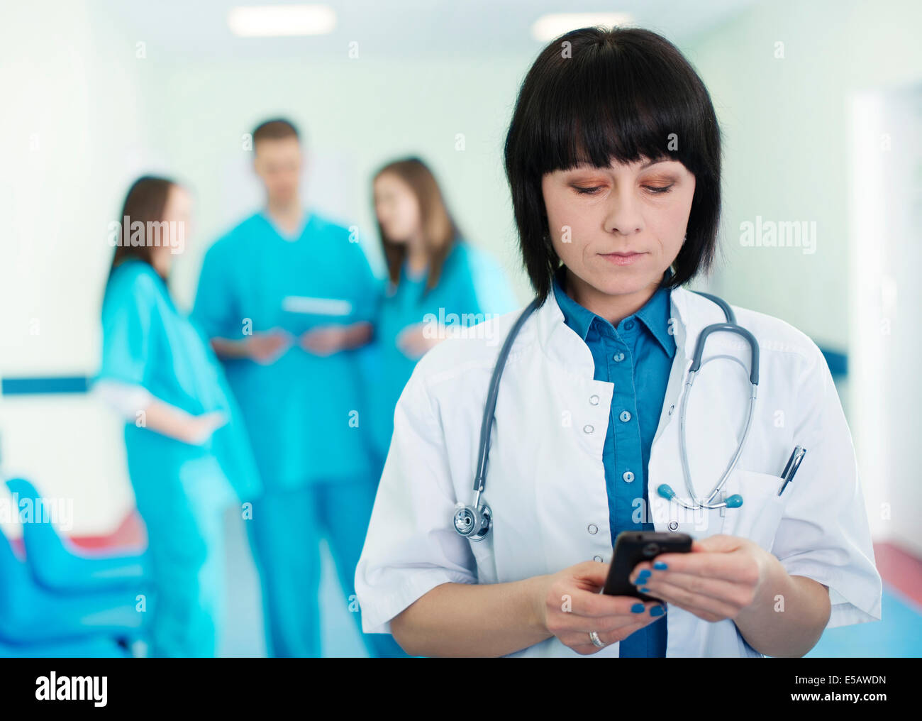 Portrait of female doctor with interns in background Debica, Poland ...