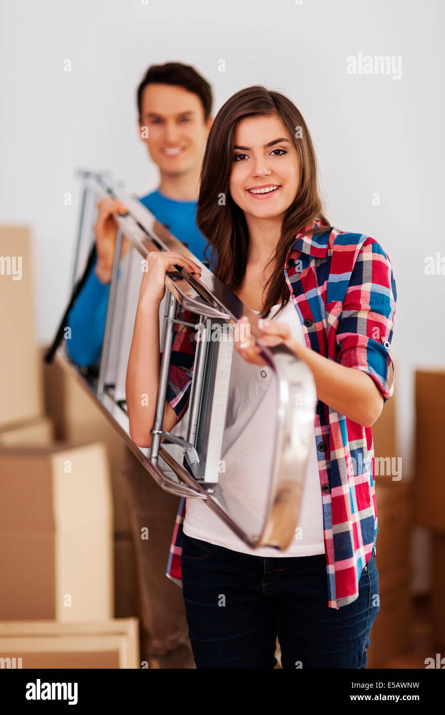Woman carrying ladder hi-res stock photography and images - Alamy