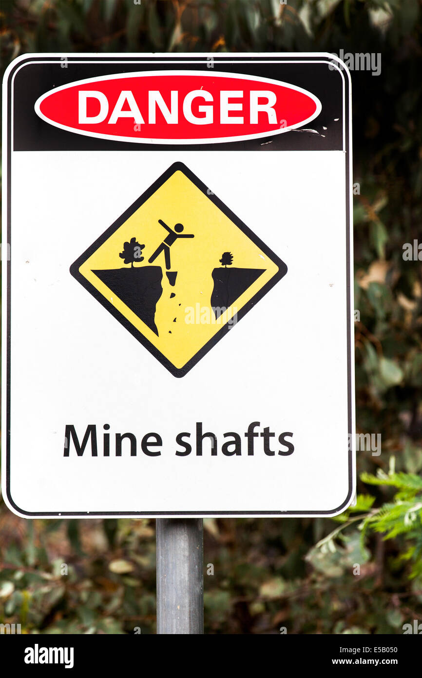Warning sign in Australia, gold mine diggings with many concealed ...
