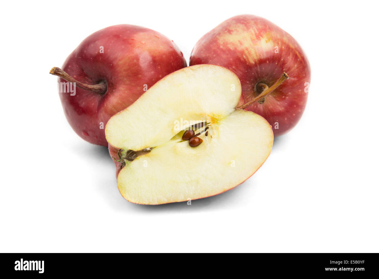 cut red apple with seeds on a white background Stock Photo - Alamy