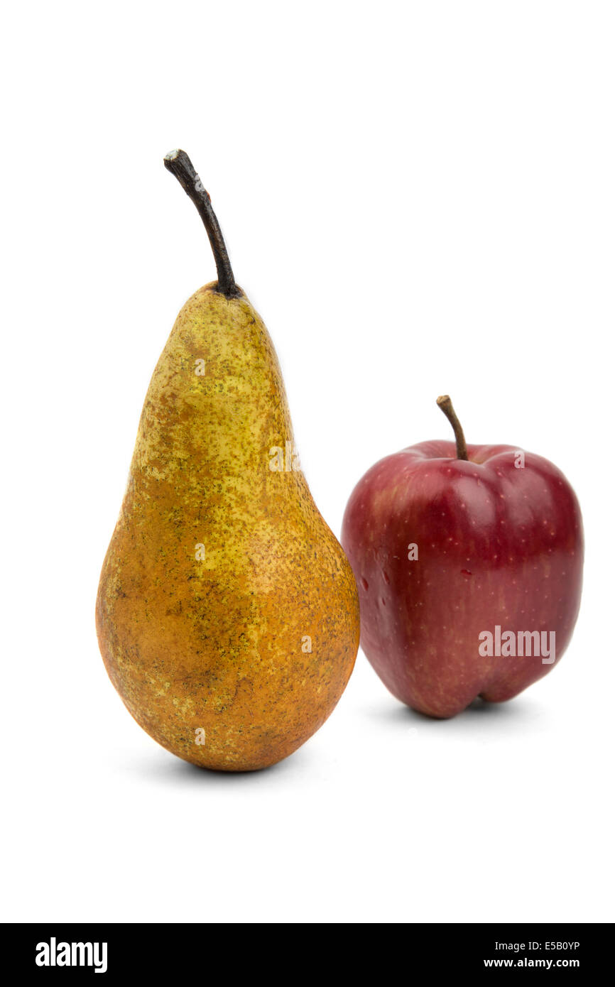 yellow pear and red apple on a white background Stock Photo - Alamy