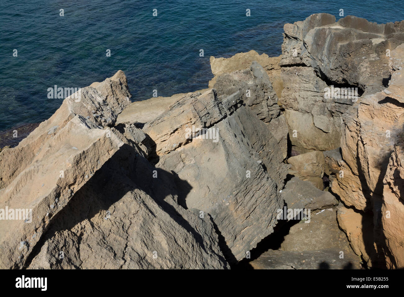 Blocks of layered limestone rock, Alcudia peninsula, Mallorca, Balearic ...