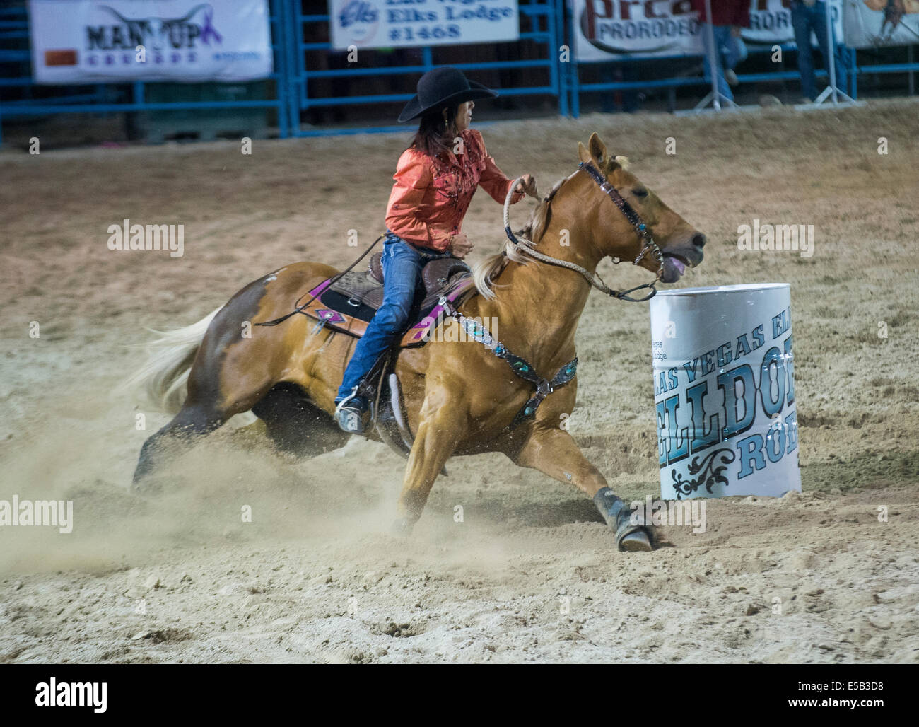 Cowgirl Participating in a Barrel racing competition at the Helldorado ...