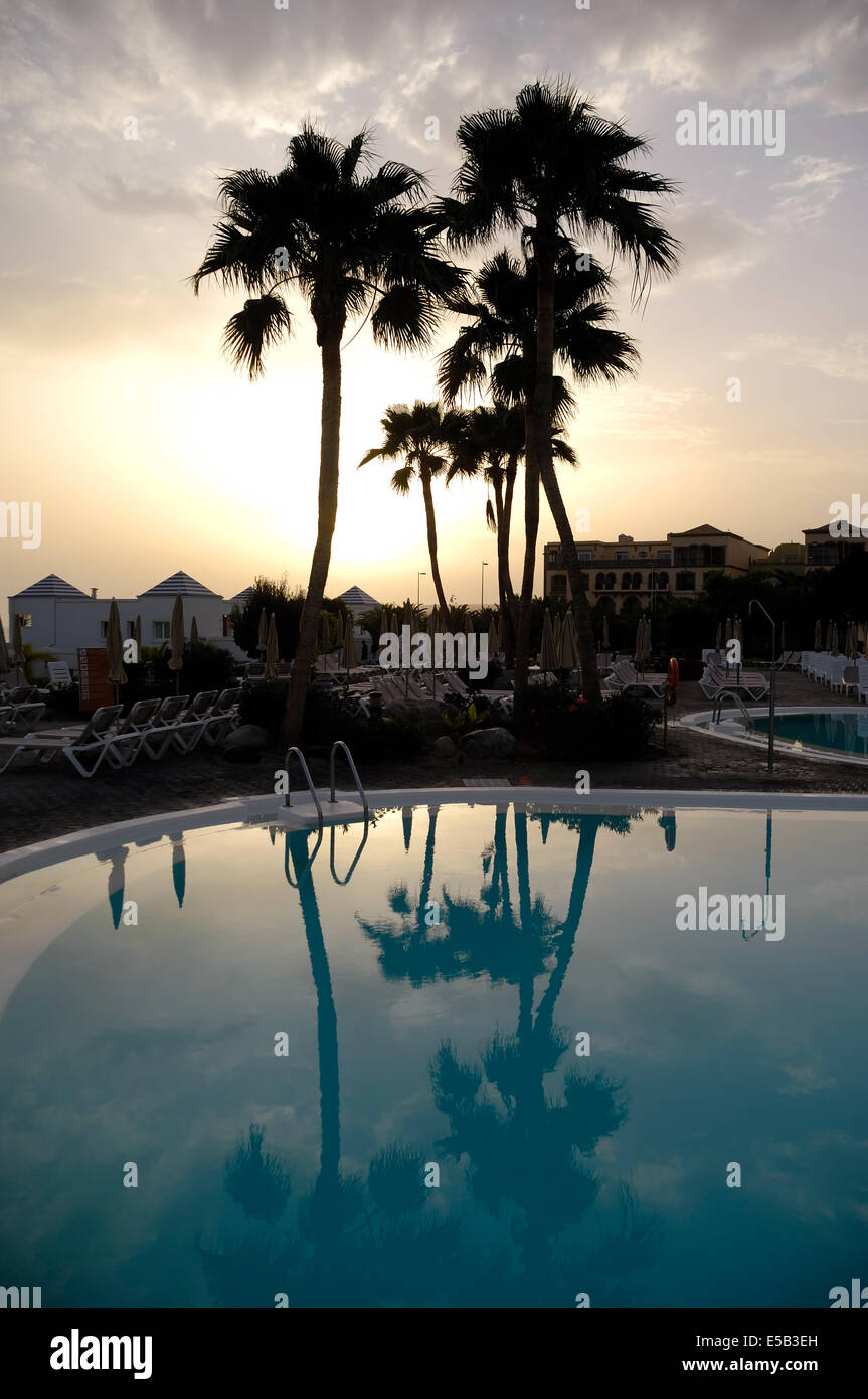 Sunset and a nice swimming pool Stock Photo - Alamy