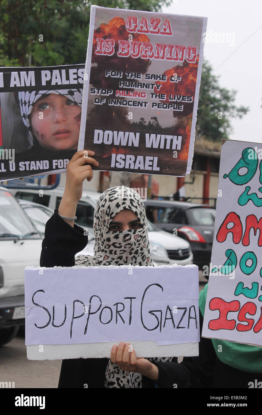 Shiite Muslim woman holds placards and shout anti-America and anti ...