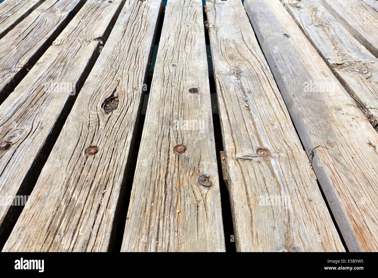 Diagonal view across old gray hard planks of a bathing jetty Stock ...