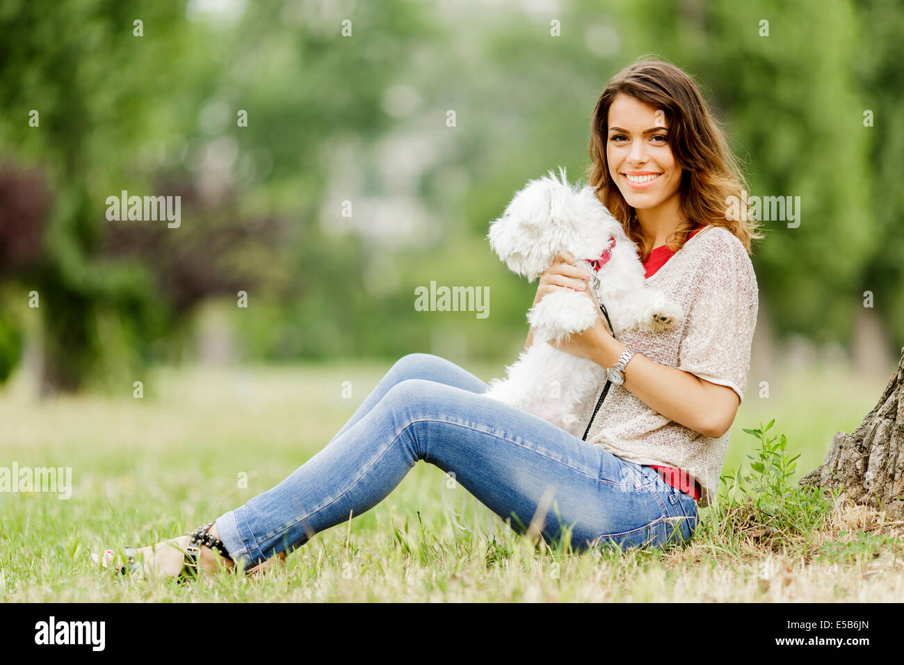 Beautiful young woman with dog hi-res stock photography and images - Alamy
