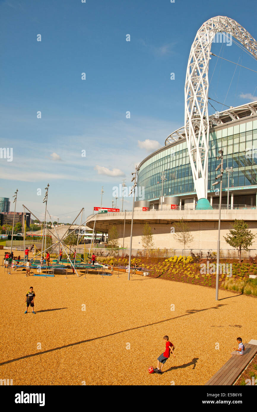 Children playing football outside Wembley Stadium,Wembley,London,UK ...