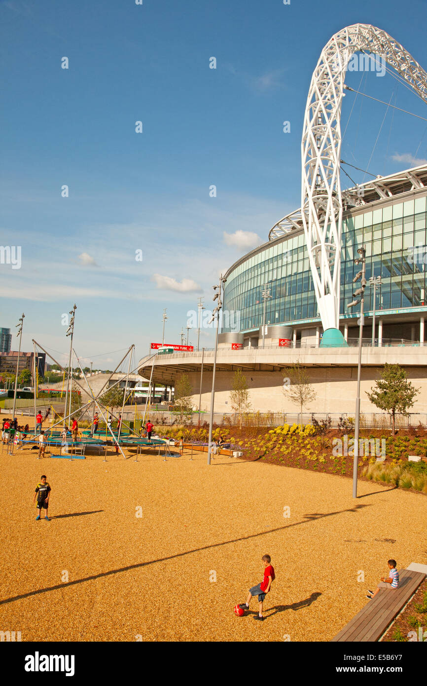 Children playing football outside Wembley Stadium,Wembley,London,UK ...