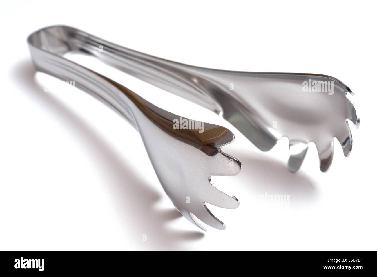 Cooking tongs of stainless steel Stock Photo - Alamy