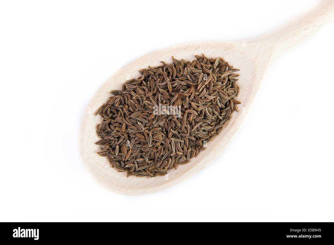 dry cumin on a spoon on white background Stock Photo - Alamy