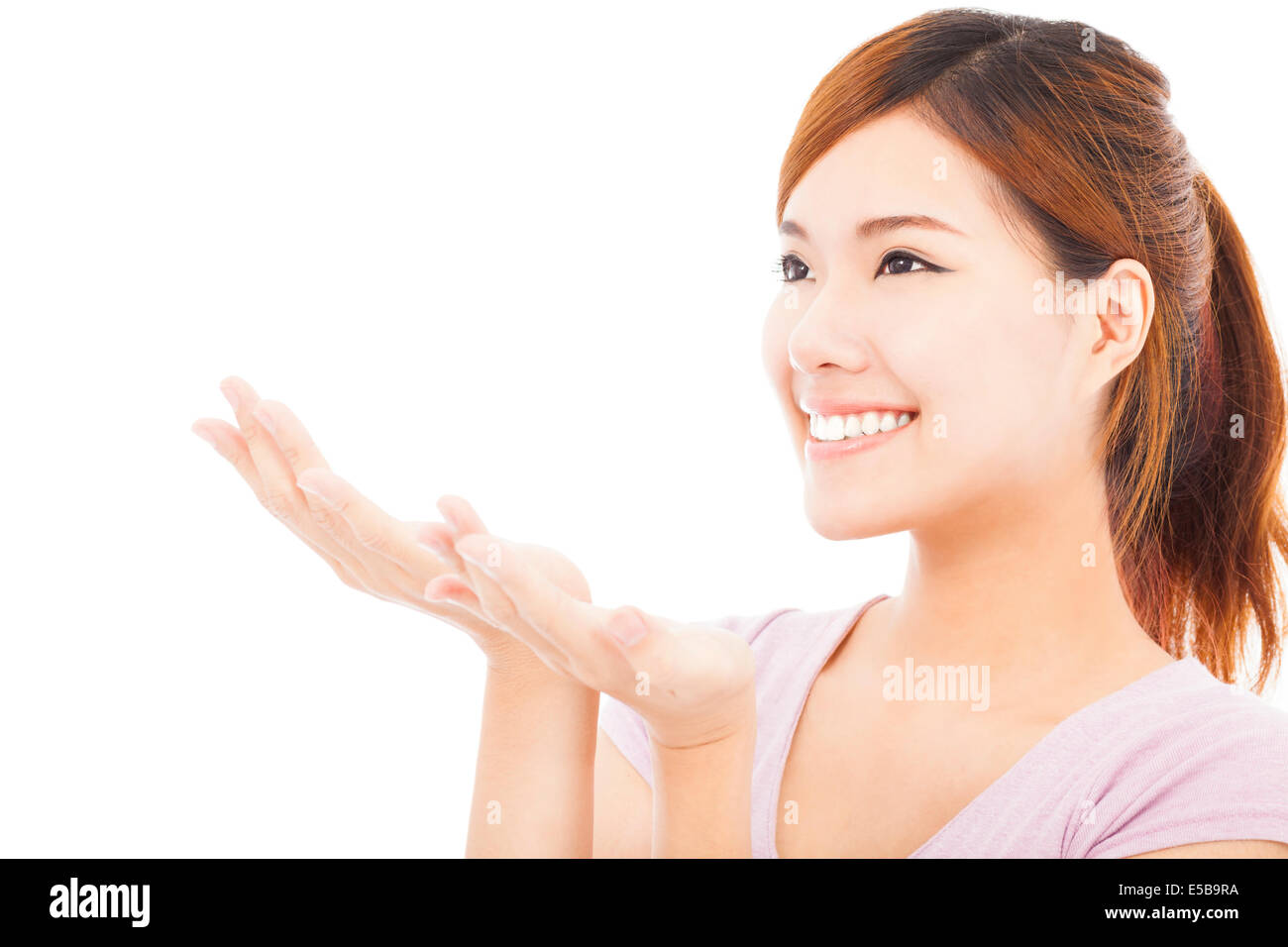 closeup of pretty woman looking the direction of hand gesture Stock ...