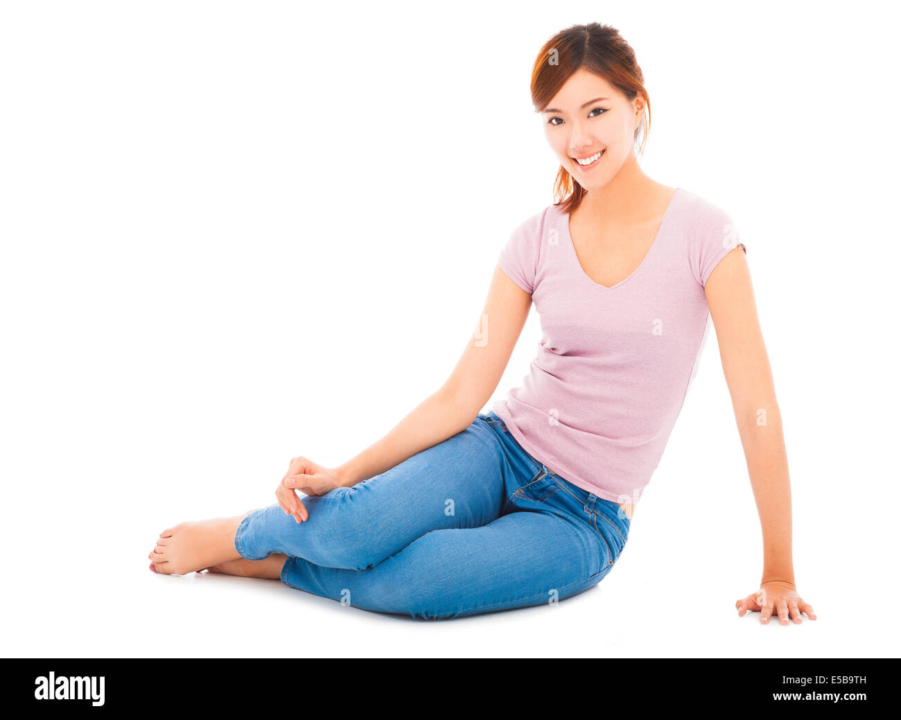 happy and beautiful young student sitting on the floor Stock Photo - Alamy