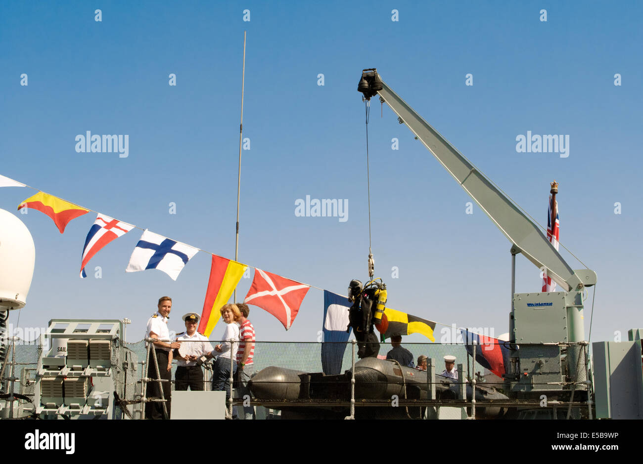 Royal Navy officers talking to journalists on HMS Bangor Stock Photo ...