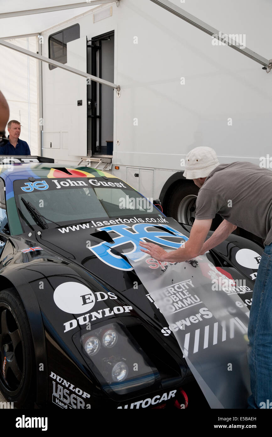 Towcester,Wiltshire, UK. 25th July, 2014. A car being sign written in ...