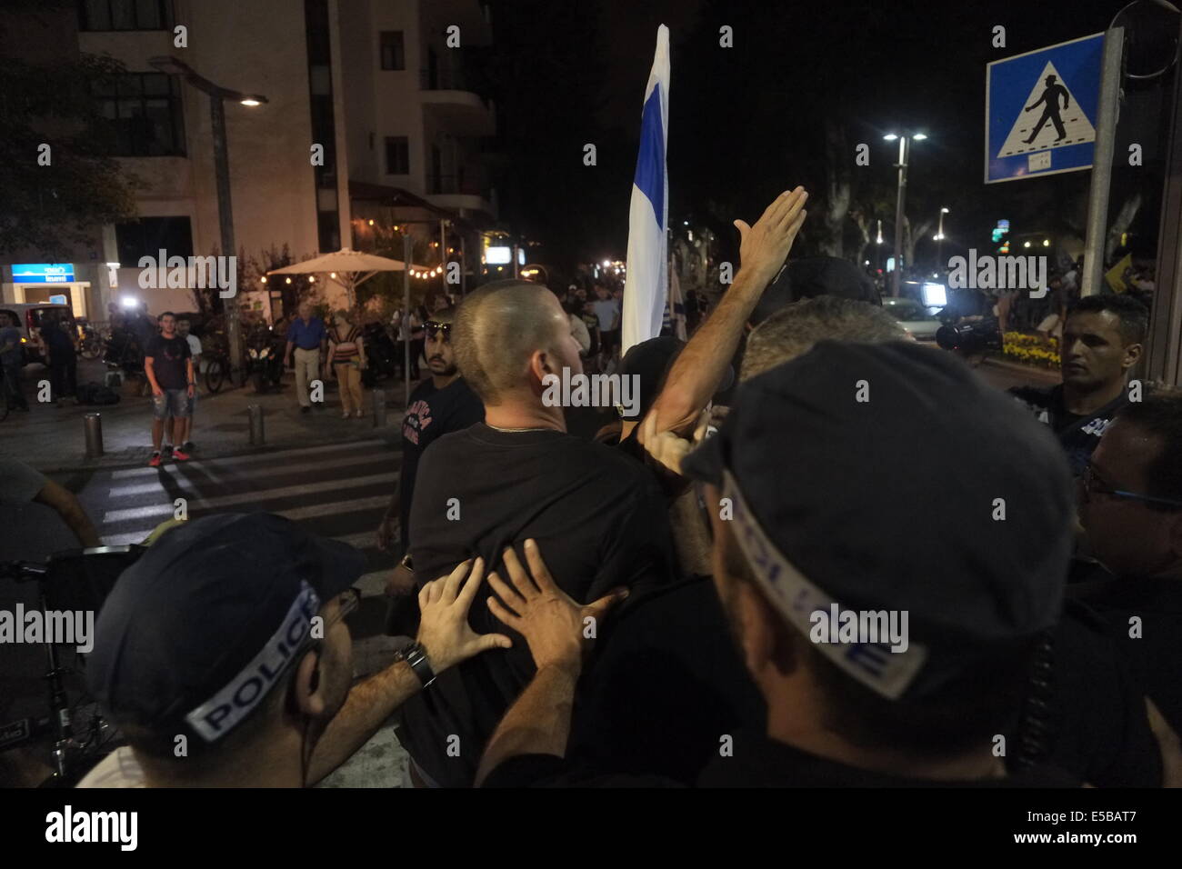 Right wing Israeli raise his arm in the street in counter-protest to ...