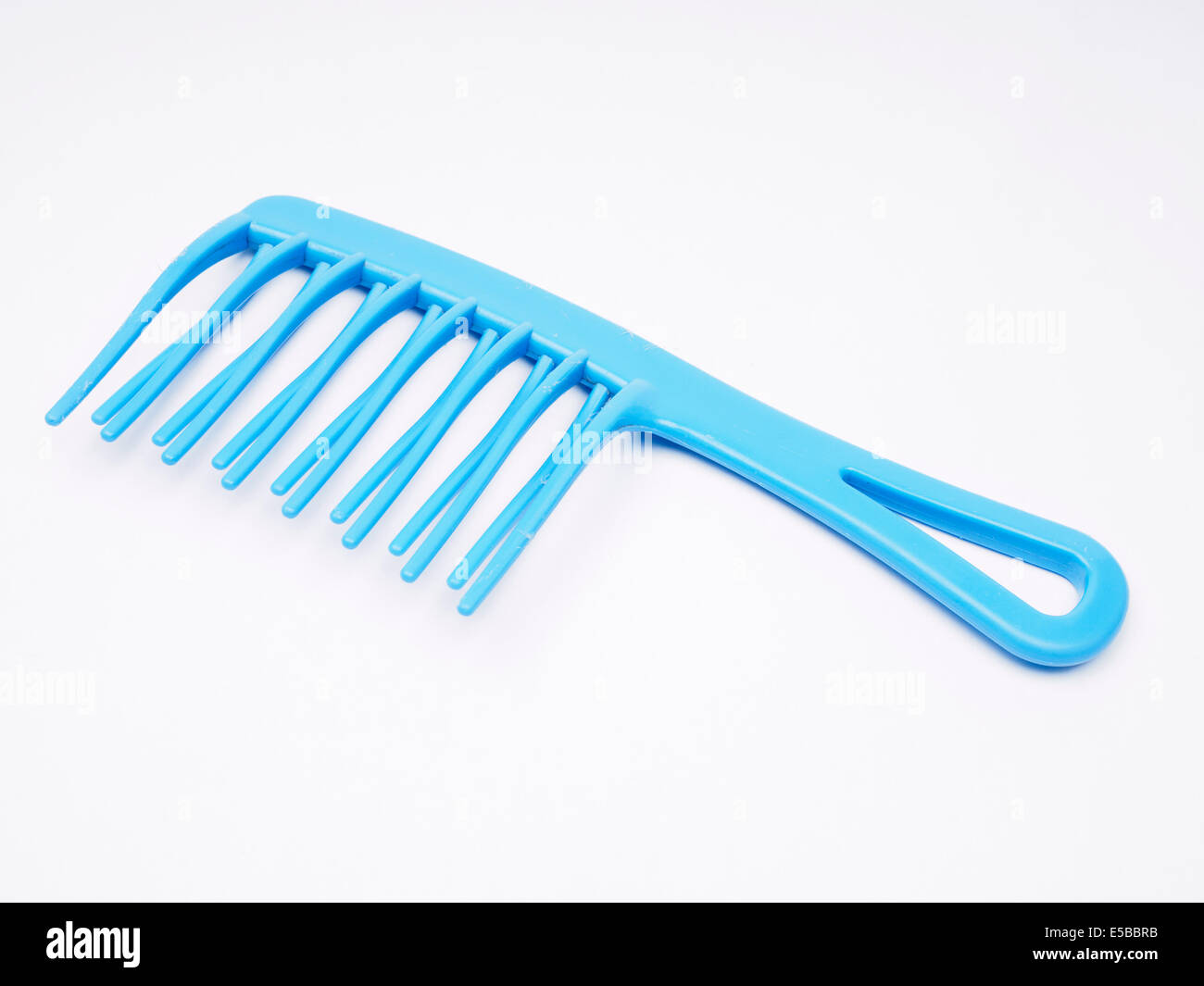 Blue plastic comb cut out isolated on white background Stock Photo - Alamy